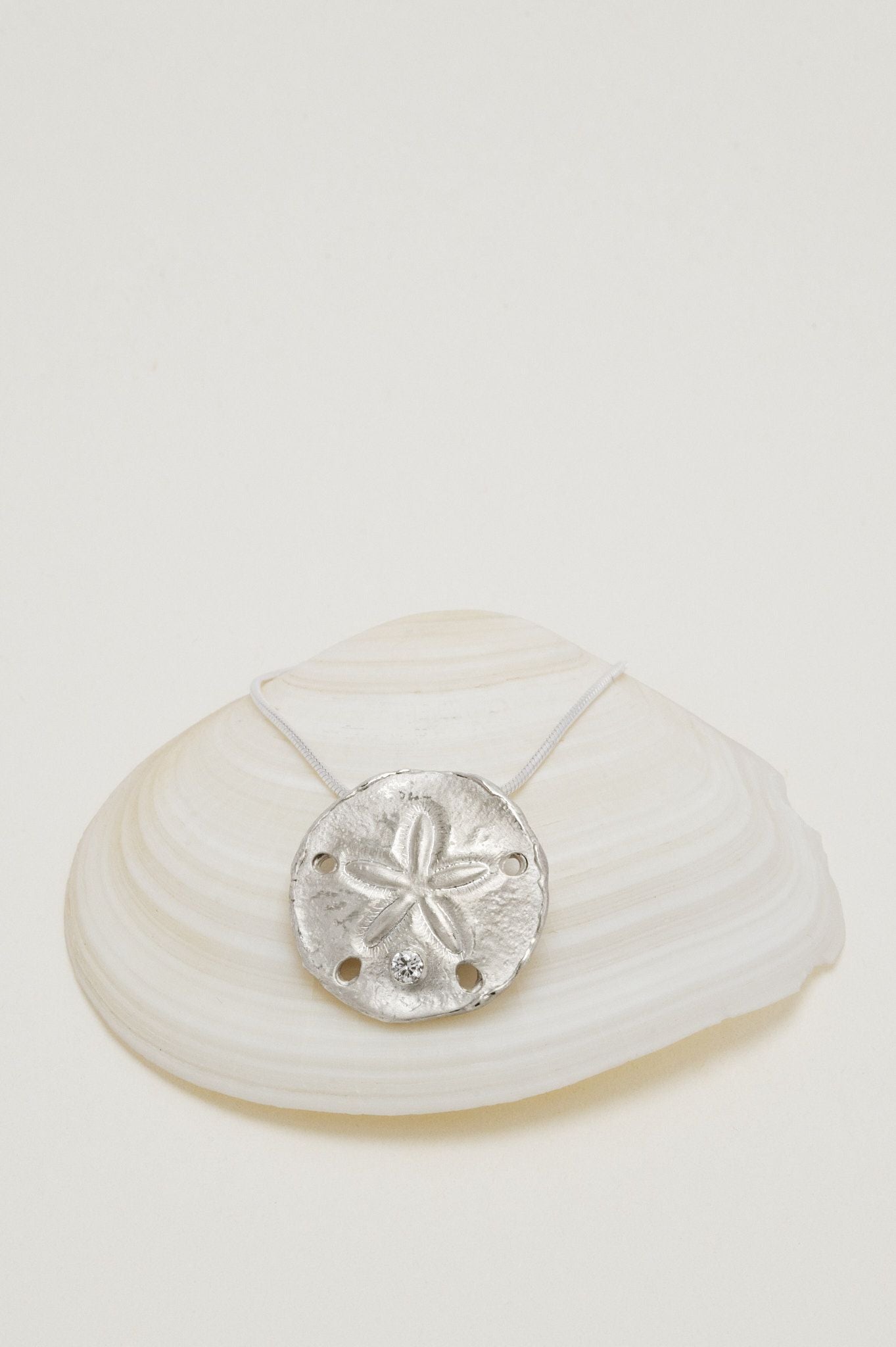 Marcella Sand Dollar – Leather Stone Metal